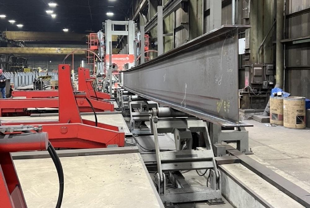 Vertical beam welding in custom structural beam fabrication