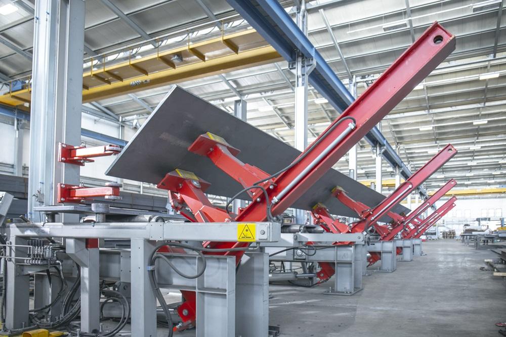 Vertical beam welding in custom structural beam fabrication